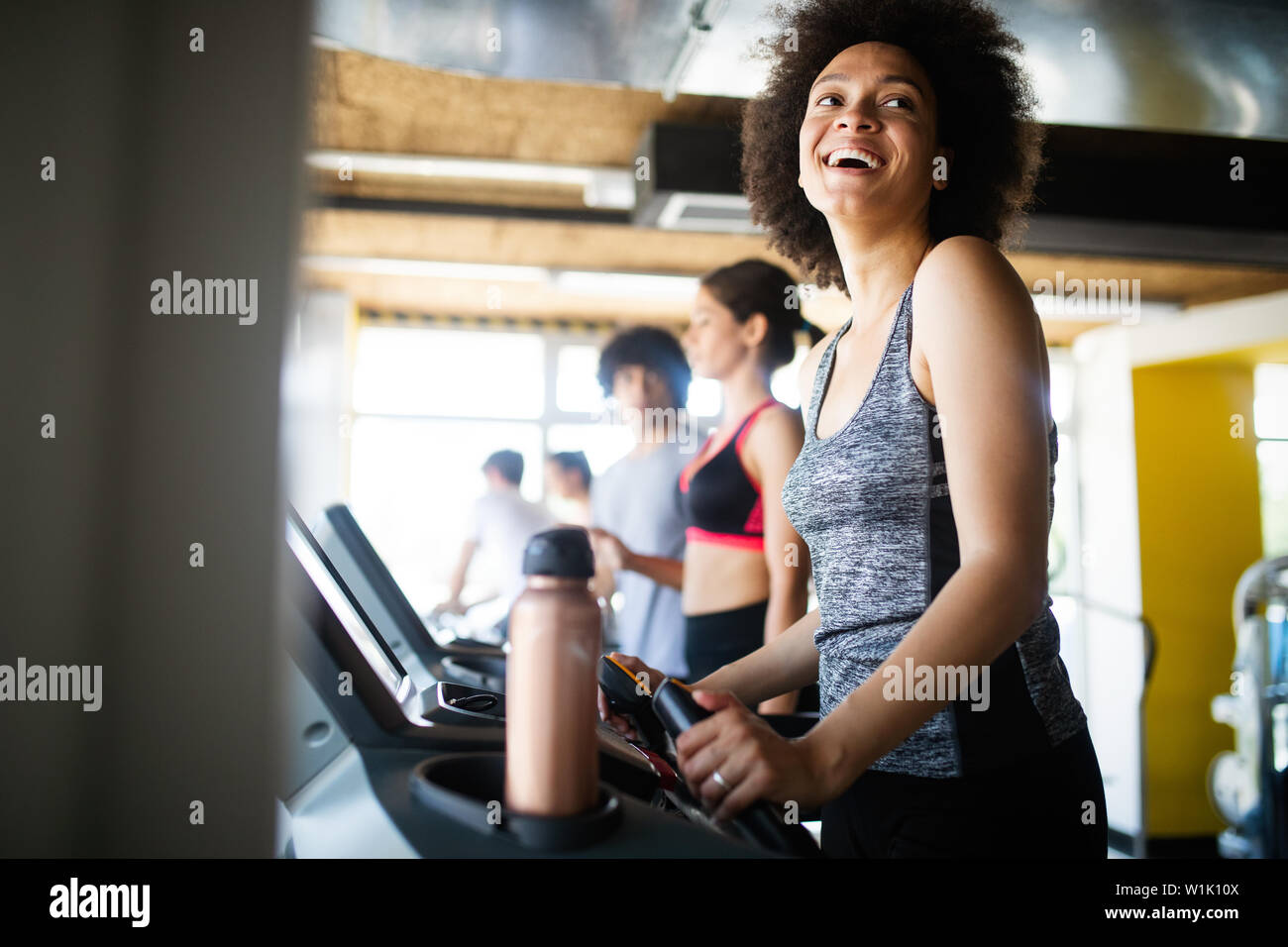 Group of healthy fit people at the gym exercising Stock Photo - Alamy