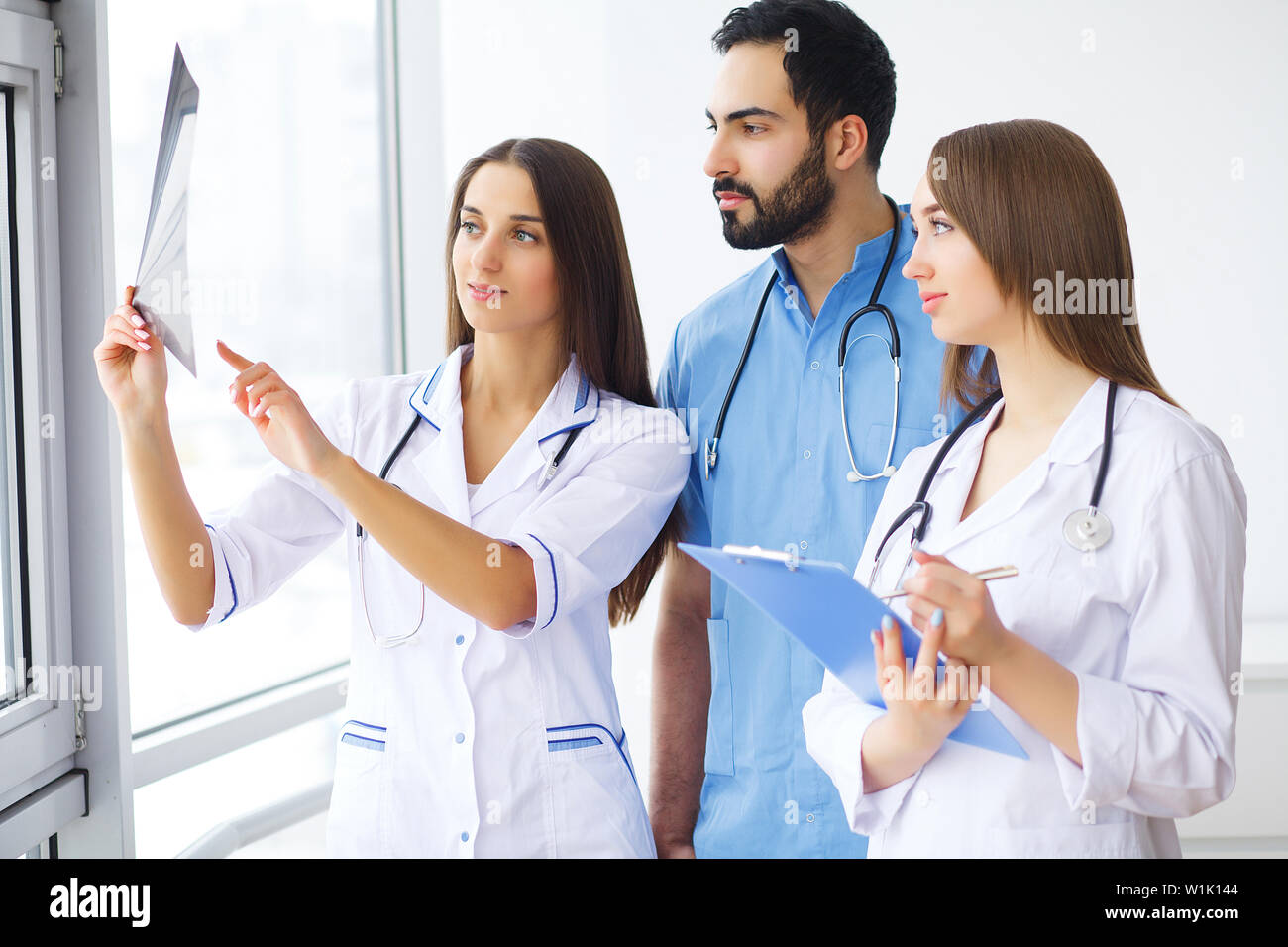 Group Of Happy Multiracial Doctors Working Together In Clinic Stock ...