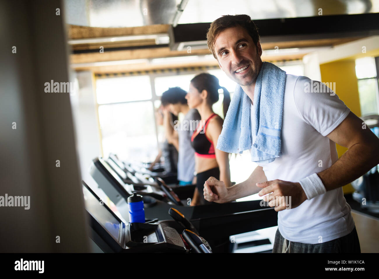 Group of healthy fit people at the gym exercising Stock Photo - Alamy