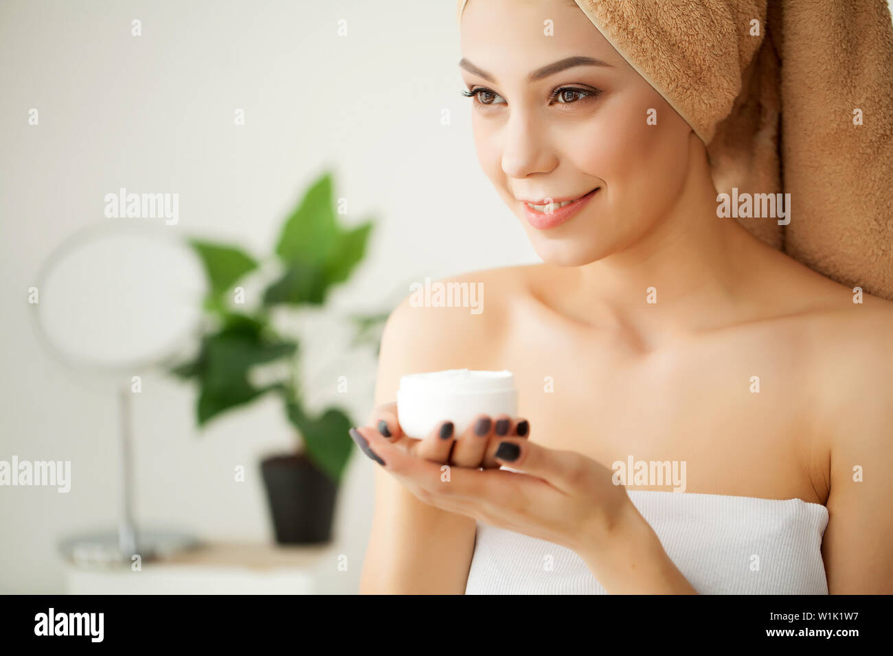 Young Spa Model with Clear Skin and Towel. Beautiful Spa Woman Applyng ...