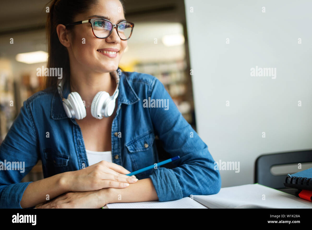 Beautiful student woman studying and learning at college Stock Photo ...