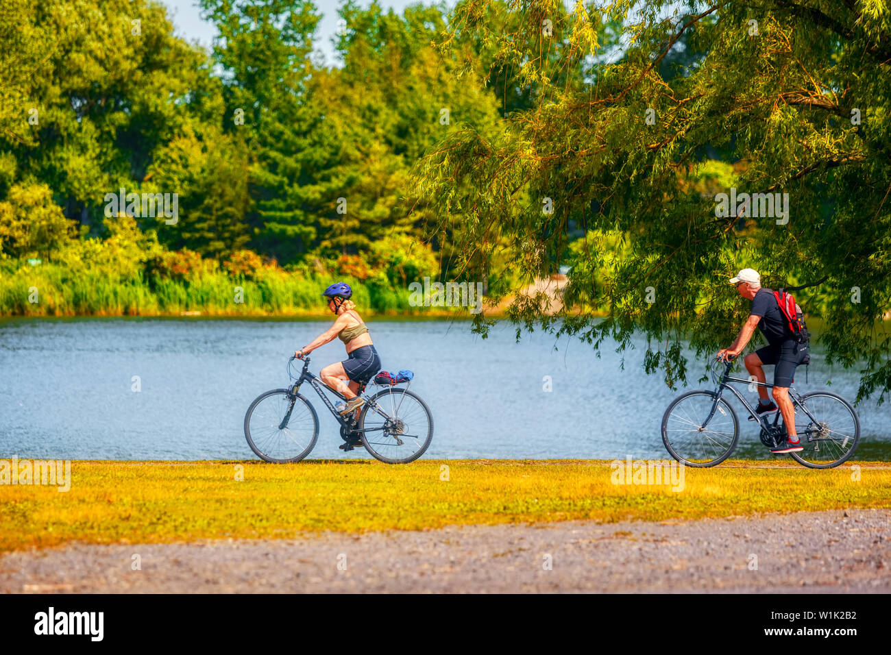 Elderly man riding bicycle bike ride exercise park cycle hi-res stock ...
