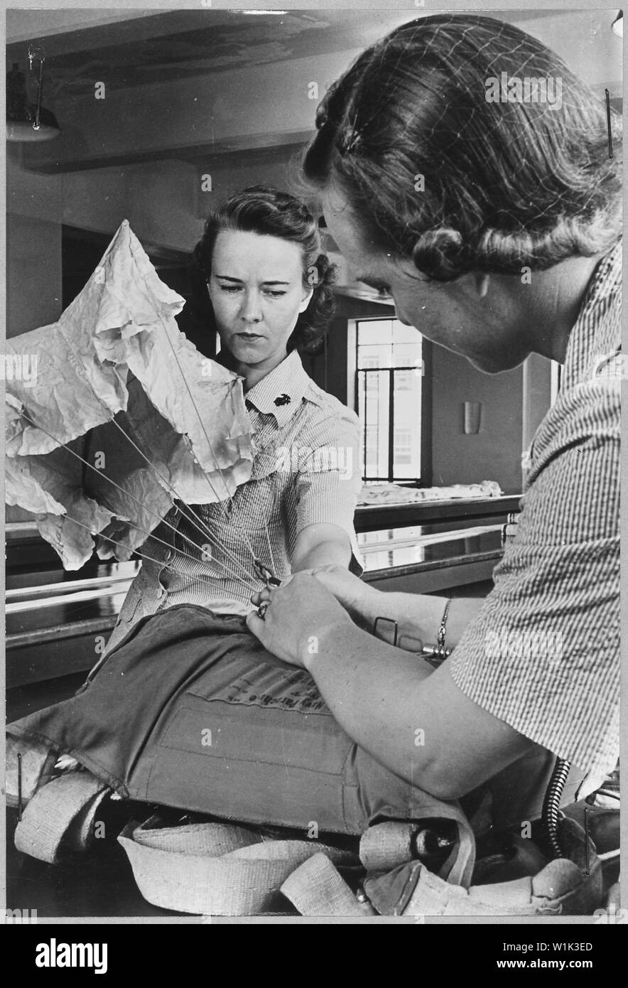 Two students at the United States Marine Corps parachute rigging school ...