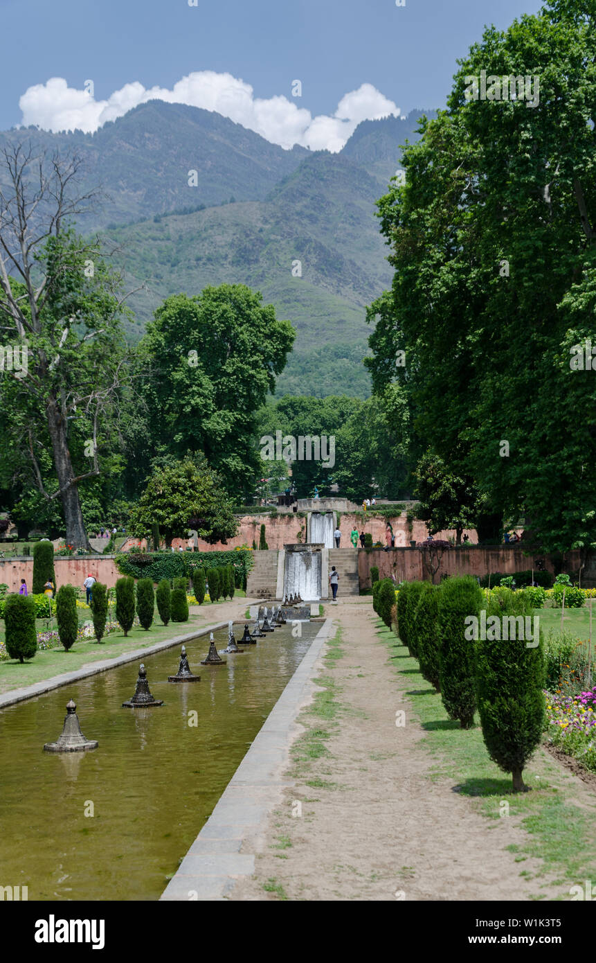 Water flowing as a stream over the terraces at Nishat Bagh with ...