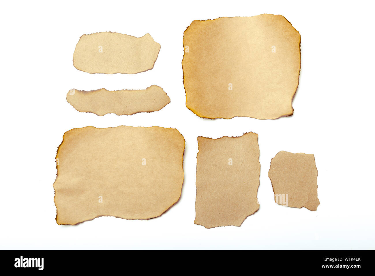brown ripped pieces of paper on white background Stock Photo - Alamy