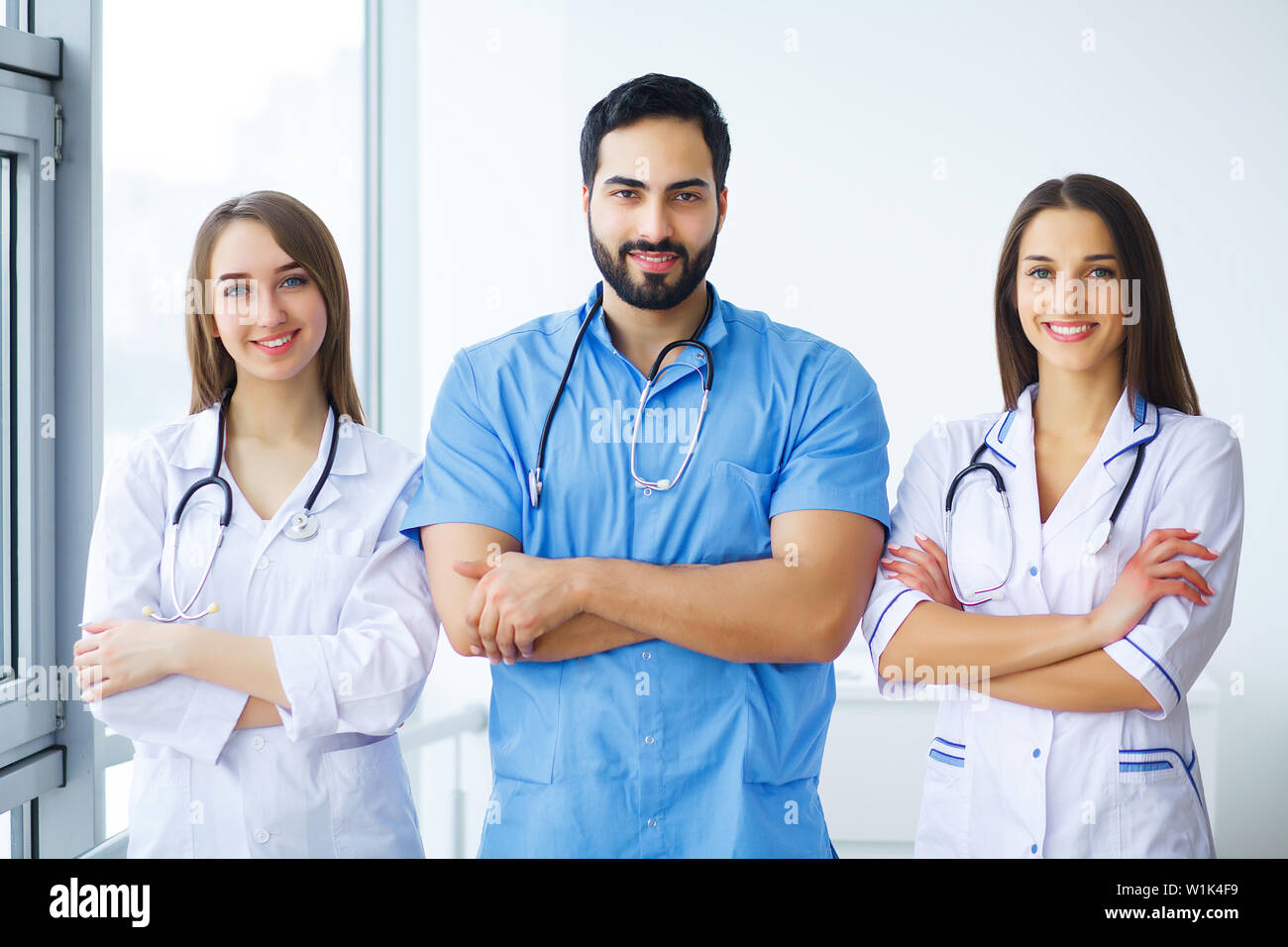 Portrait of medical team standing with arms crossed in hospital Stock ...