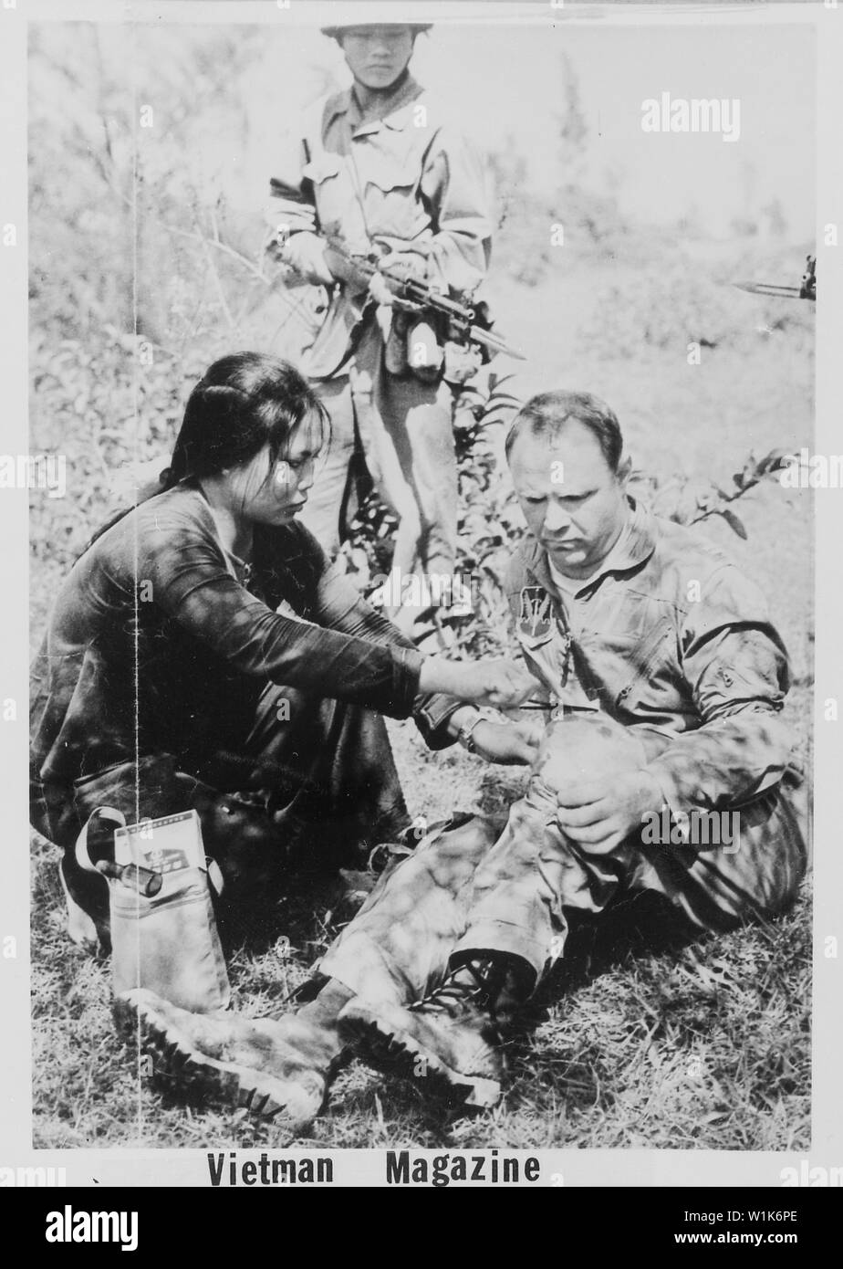 United States Air Force Captain Wilmer N. Grubb is given first aid ...