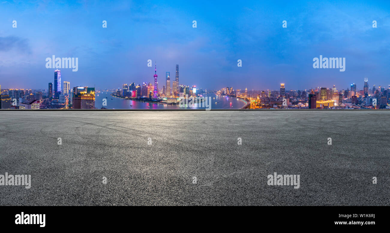 Shanghai skyline panoramic view with asphalt road at night,China Stock ...