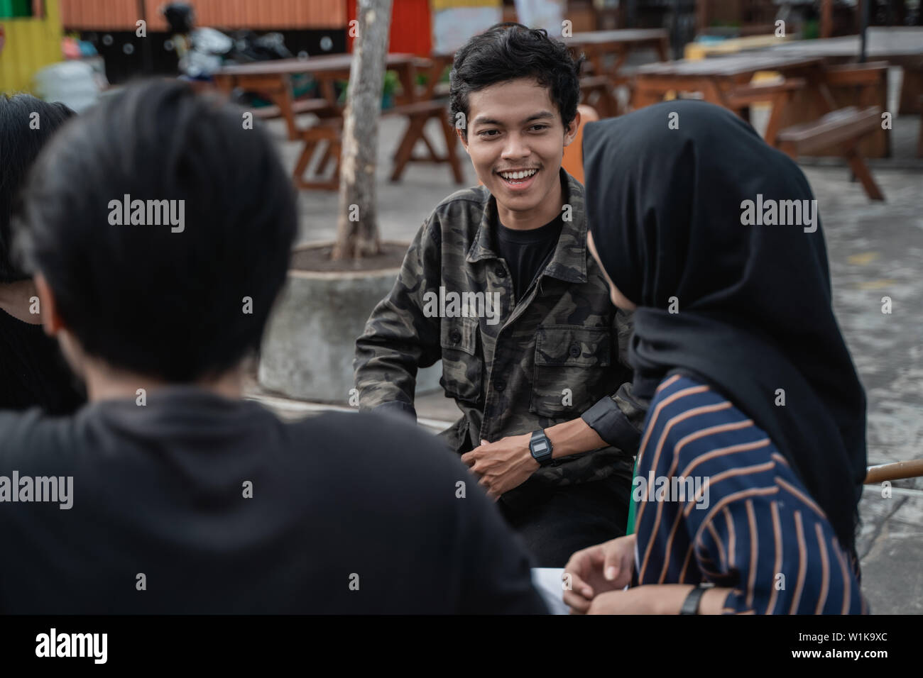 enjoy chatting and sharing with friends Stock Photo - Alamy