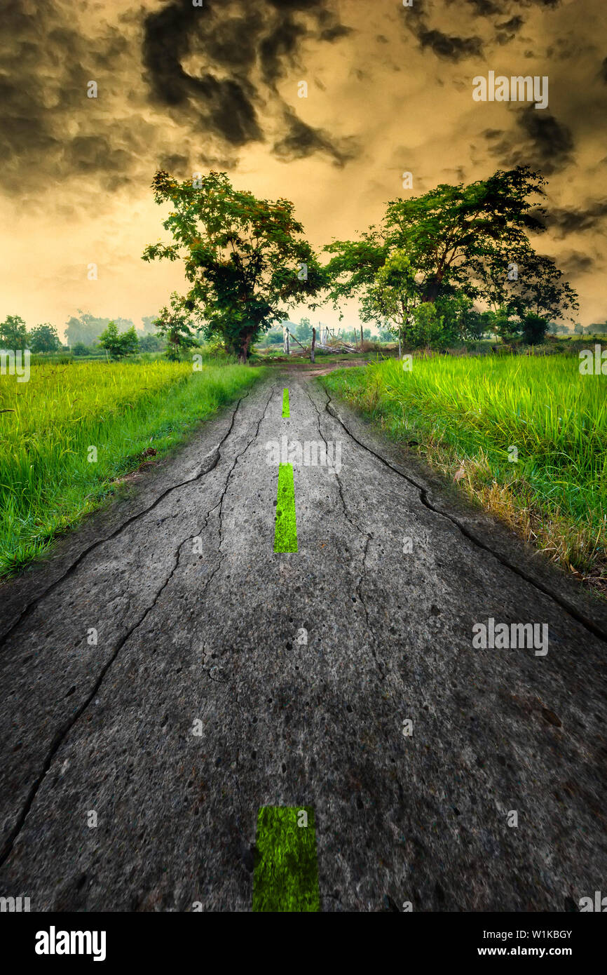 rain clouds over rural road landscape Stock Photo - Alamy