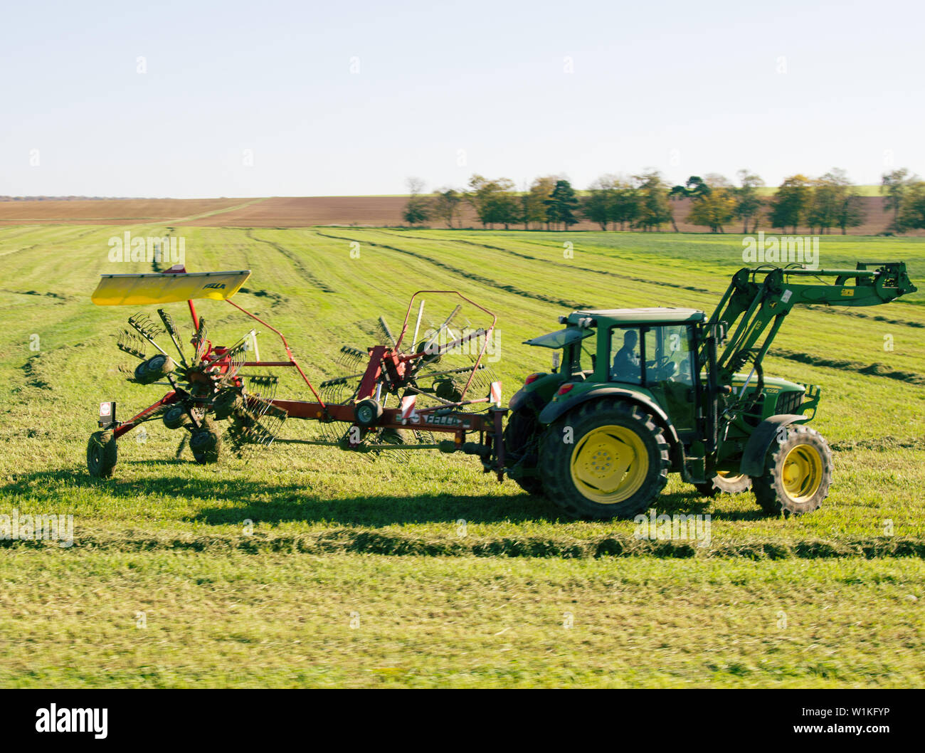 Lion, France - 16.10.2017: Farm Tractor with hay turner; tedding ...