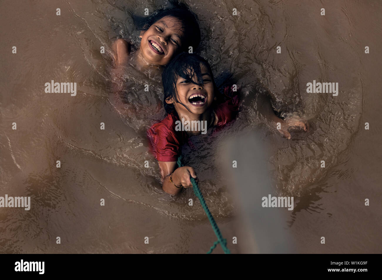 wet water child people calamity Stock Photo - Alamy