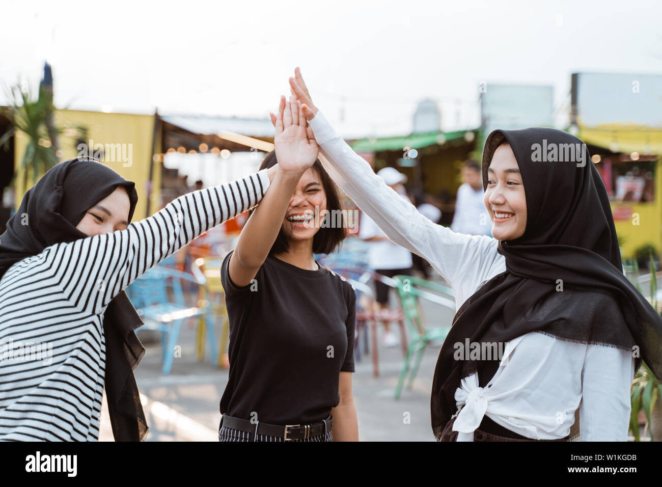 young people raised hands together Stock Photo - Alamy