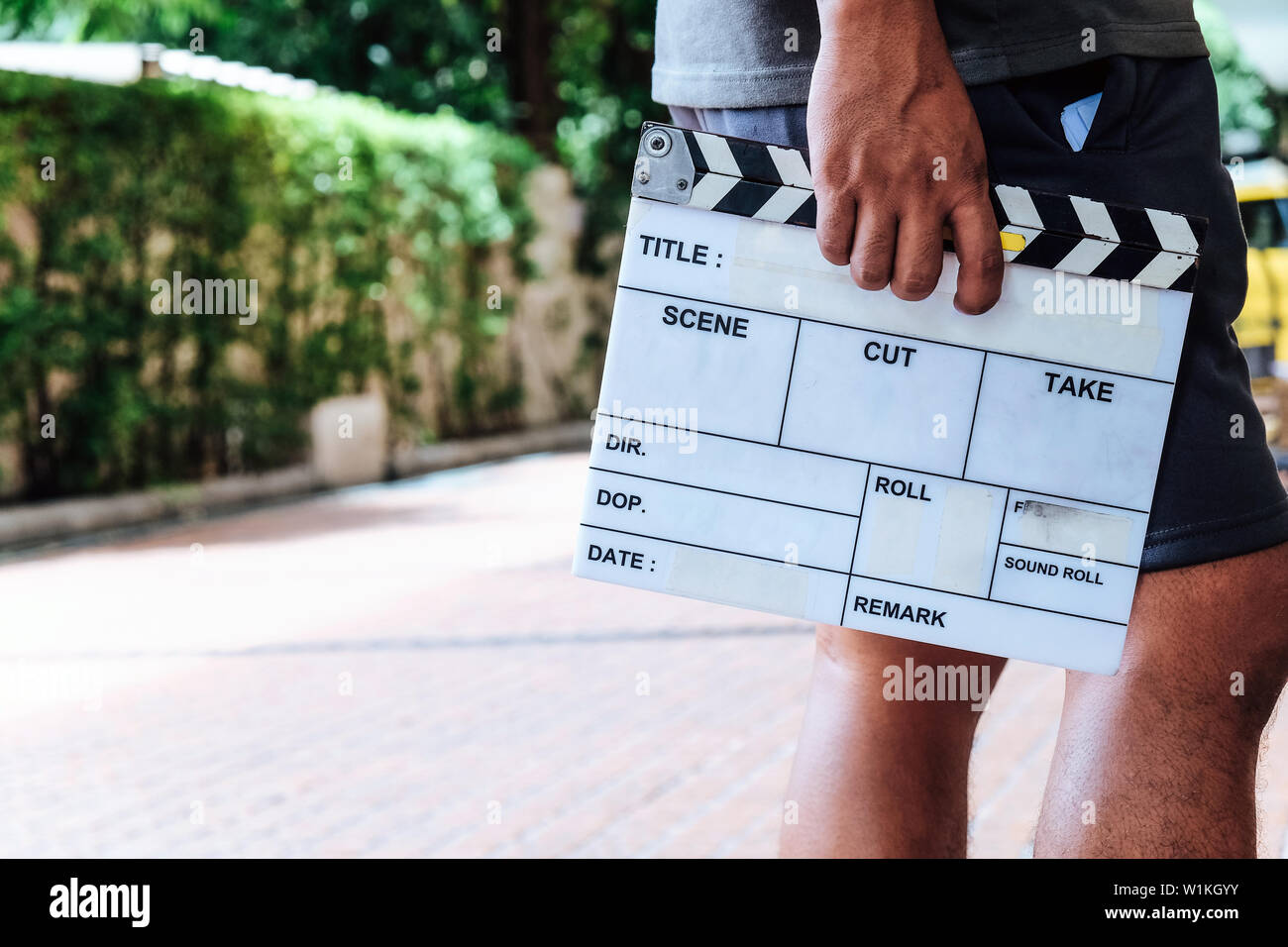 Man hands holding movie clapper hi-res stock photography and images - Alamy