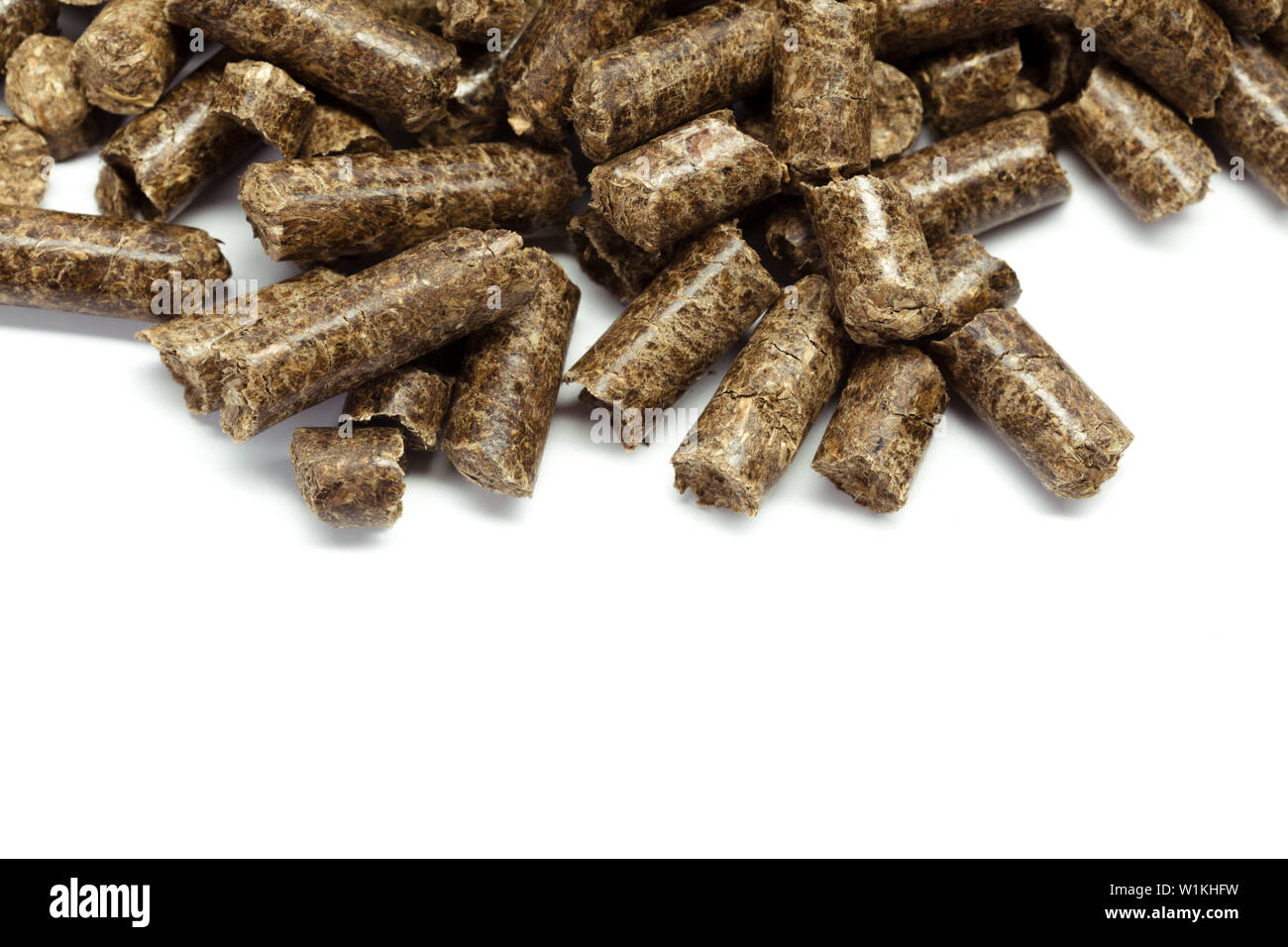 stack of wooden pellets for bio energy, white background, isolated ...