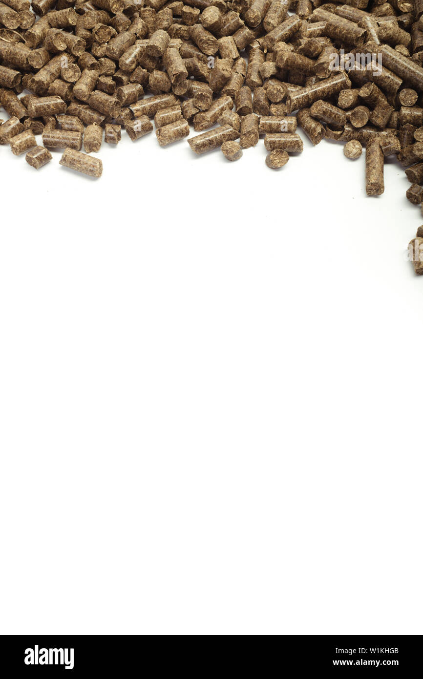 stack of wooden pellets for bio energy, white background, isolated ...