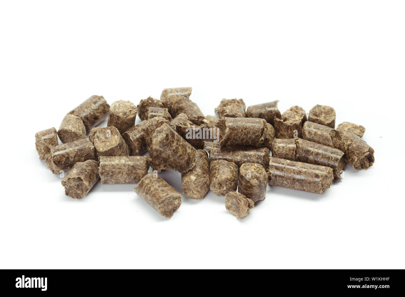 stack of wooden pellets for bio energy, white background, isolated ...