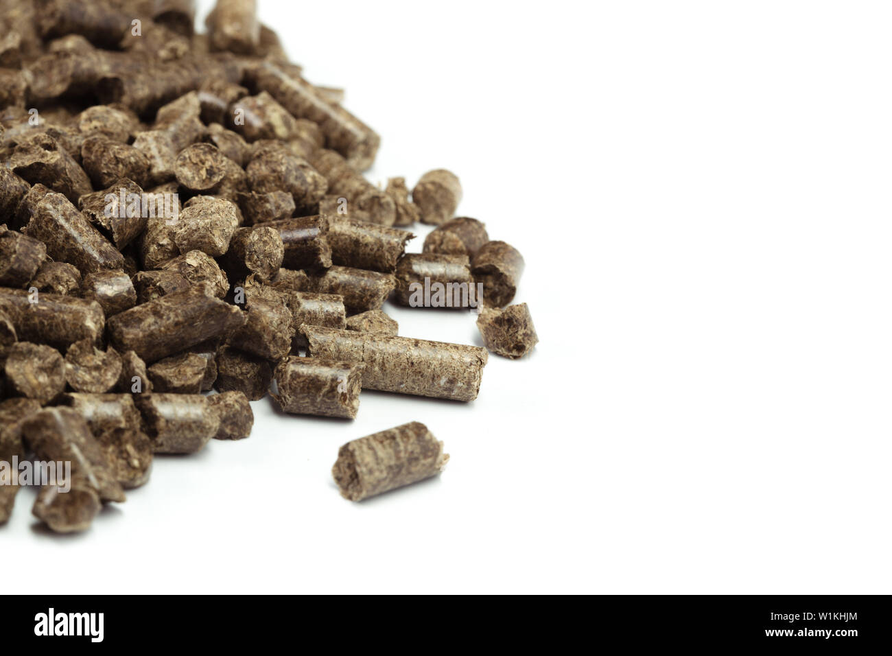 stack of wooden pellets for bio energy, white background, isolated ...