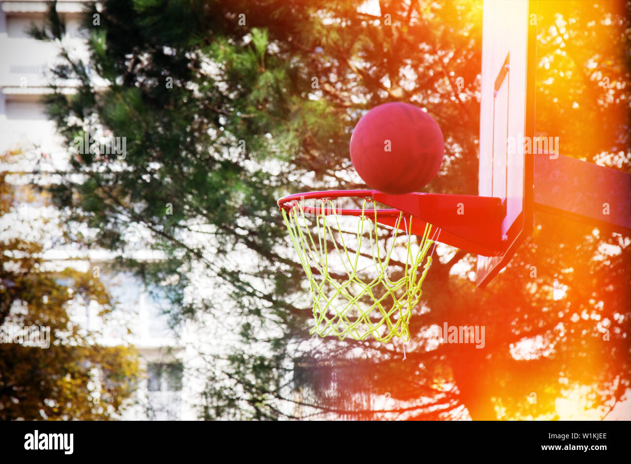 The basketball flies in rim or misses. Yard Playground. Basketball ...