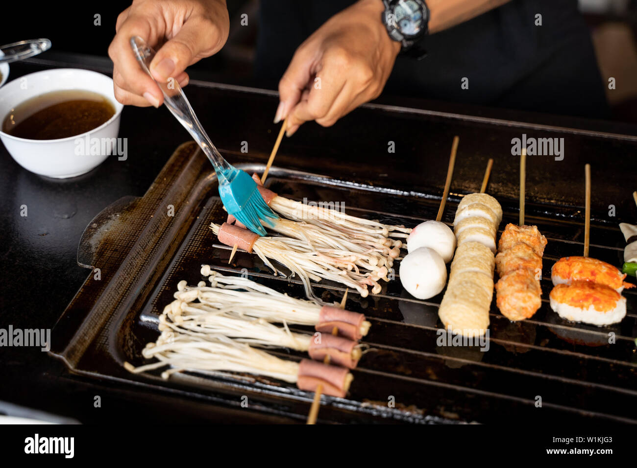 human hands cook stewed food Stock Photo - Alamy