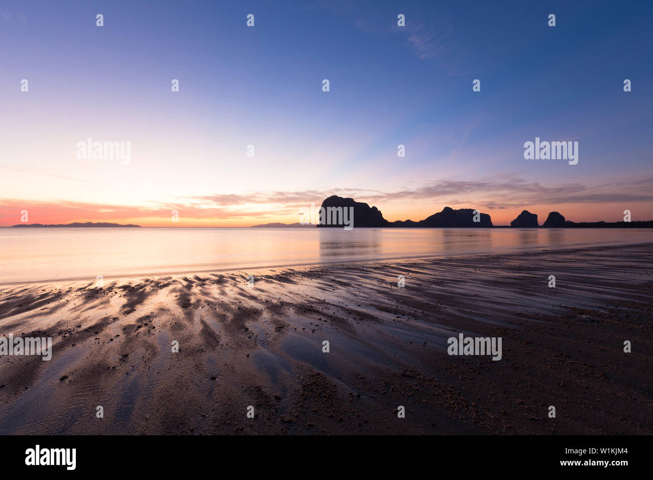 Sunset on the beach of Pak Meng, Thailand Stock Photo - Alamy