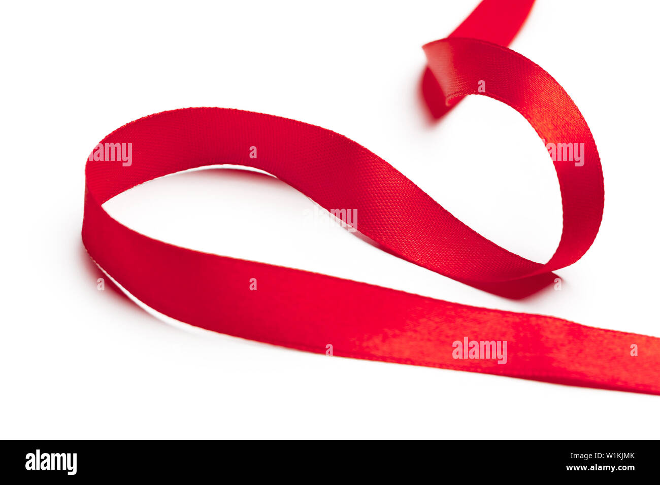 Red ribbon on white background Stock Photo - Alamy