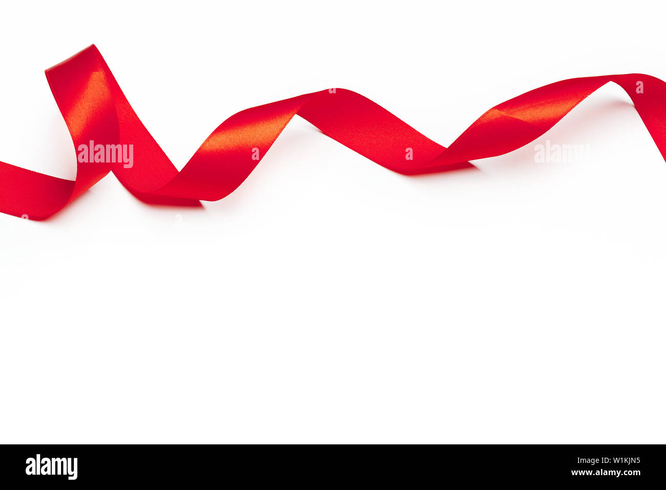 Red ribbon on white background Stock Photo - Alamy