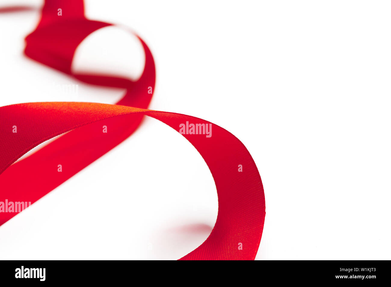 Red ribbon on white background Stock Photo - Alamy