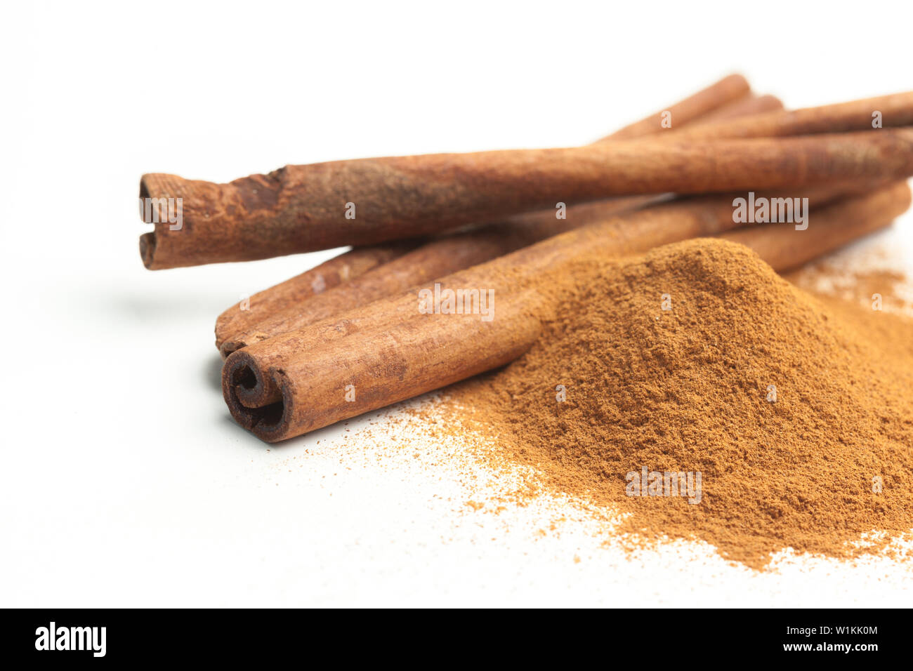 Cinnamon sticks on white background Stock Photo - Alamy