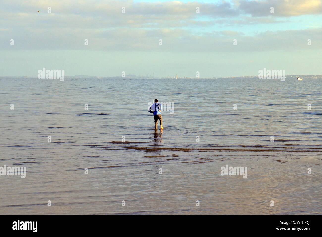 Man standing in ocean waves hi-res stock photography and images - Alamy