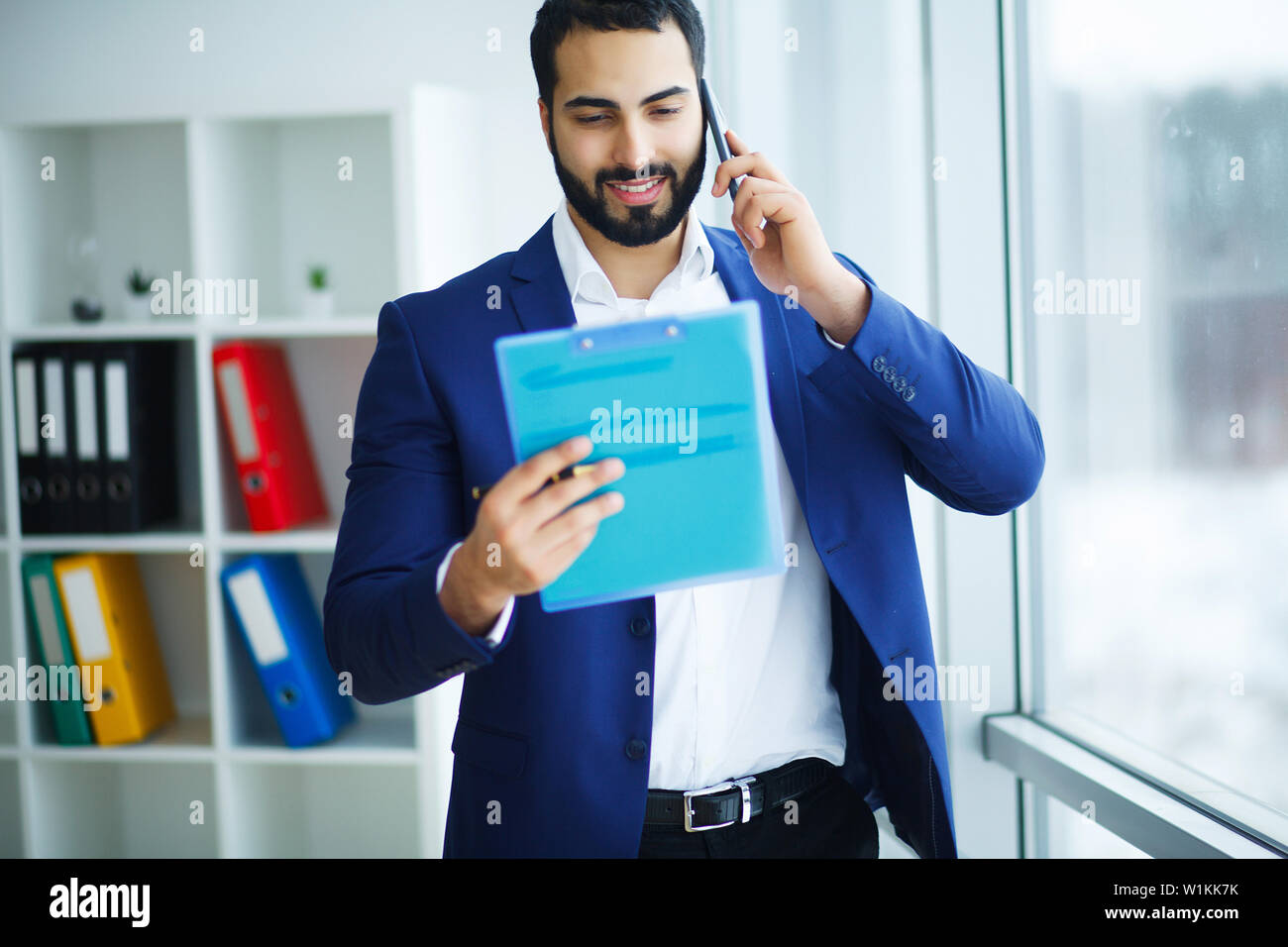 Portrait of a handsome CEO smiling in his office Stock Photo - Alamy