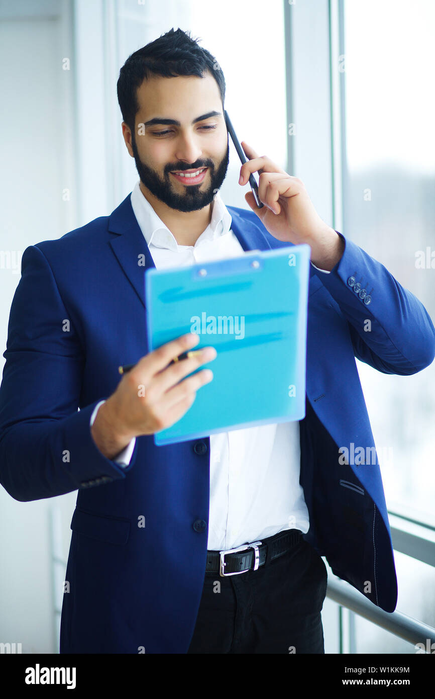 Portrait of a handsome CEO smiling in his office Stock Photo - Alamy