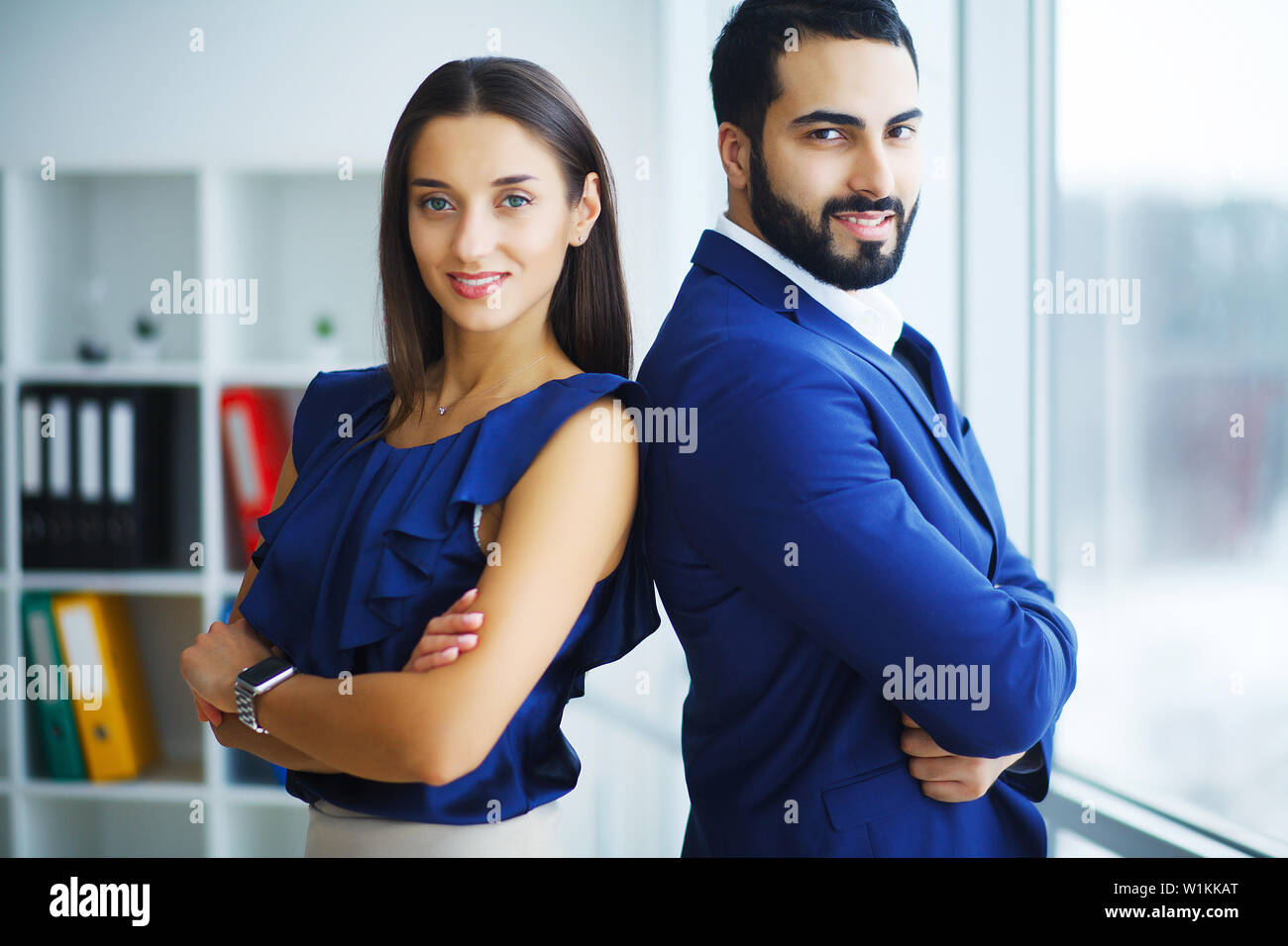 Young colleagues at work in modern office Stock Photo - Alamy