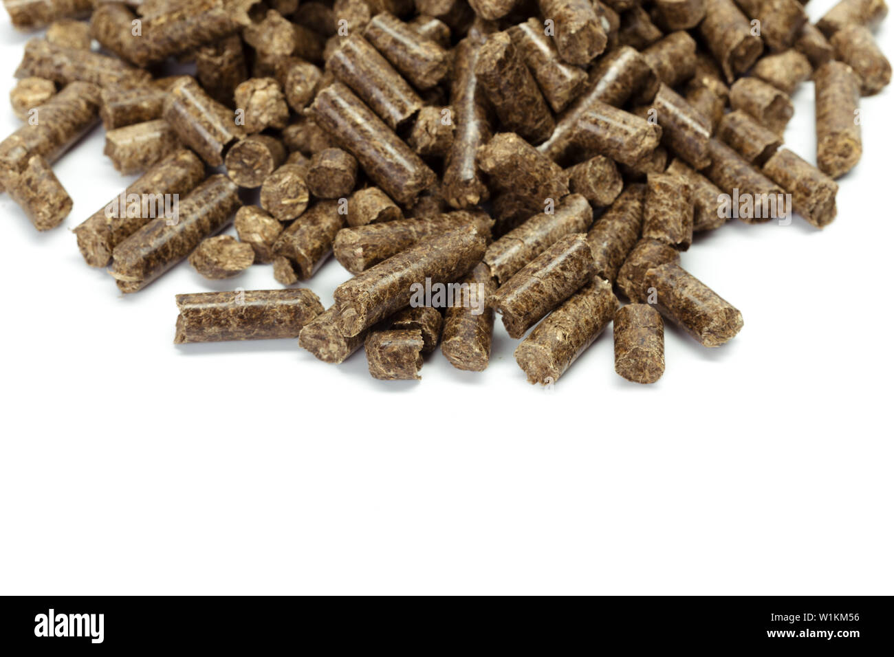 stack of wooden pellets for bio energy, white background, isolated ...