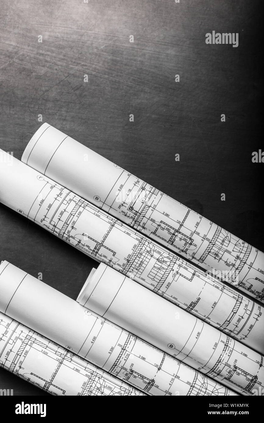 Construction planning drawings on black background Stock Photo - Alamy