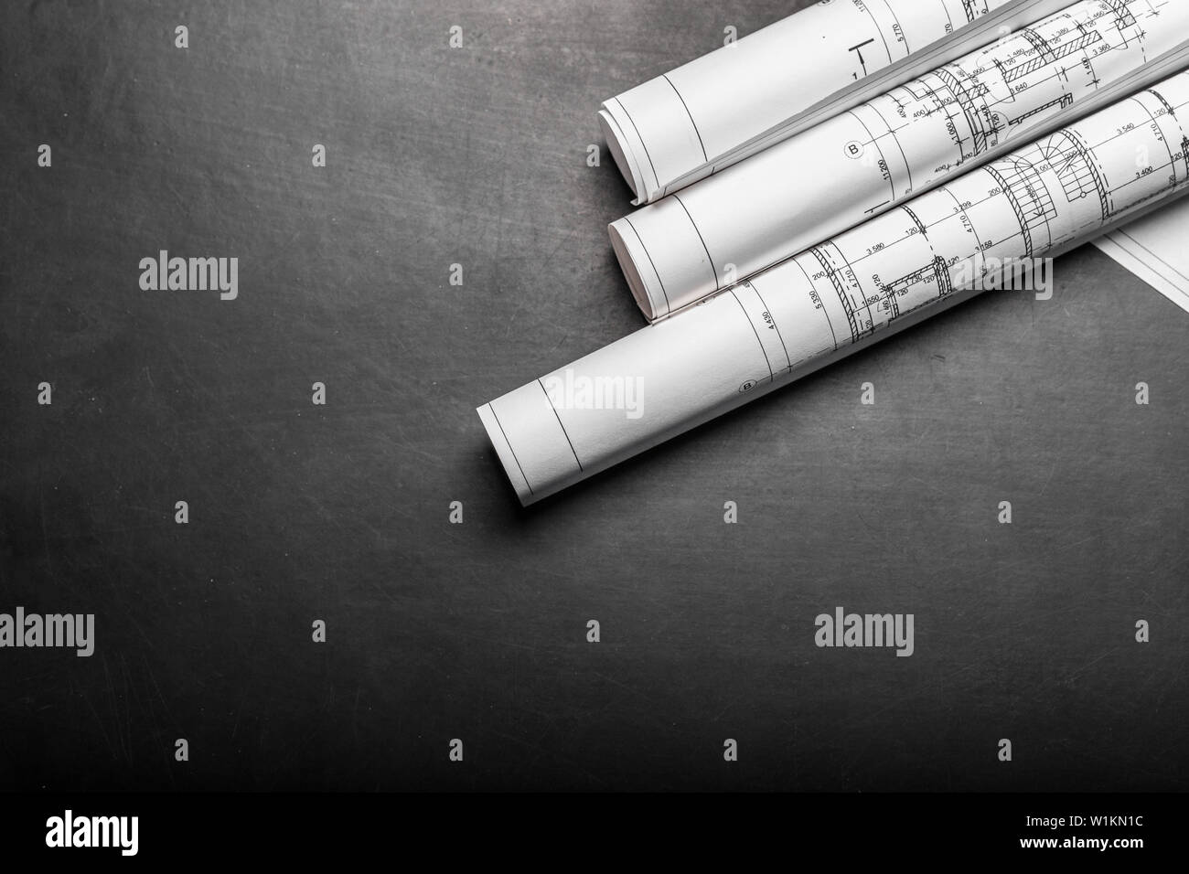Construction planning drawings on black background Stock Photo - Alamy