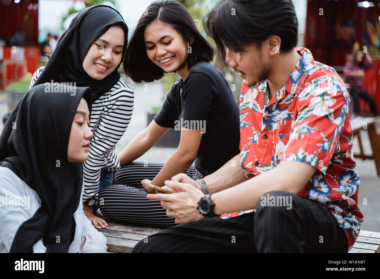 Group of friends talking at the outdoor Stock Photo - Alamy