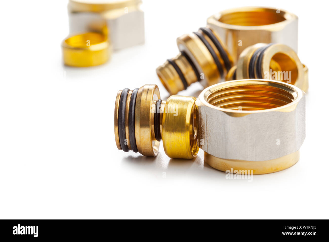 Set of metal-plastic plumbing couplings, adapters, plugs isolated on ...