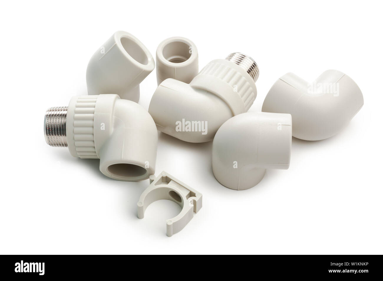 Set of metal-plastic plumbing couplings, adapters, plugs isolated on ...