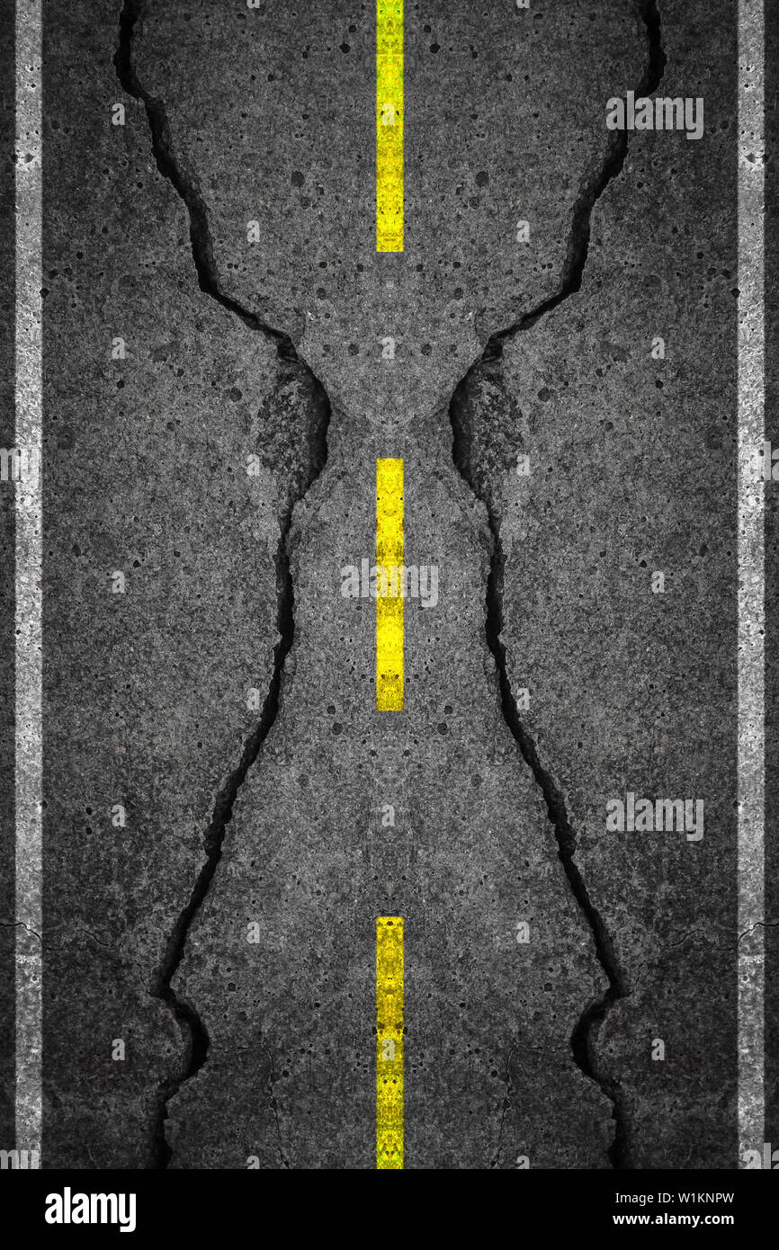 Cracks on asphalt the yellow line dividing lanes Stock Photo - Alamy