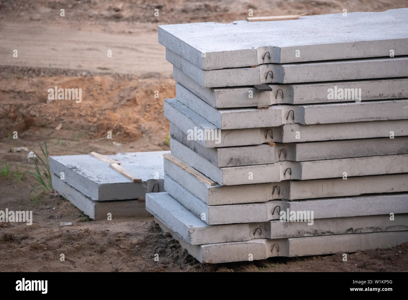 description: Grey concrete slabs preparing for building Stock Photo - Alamy