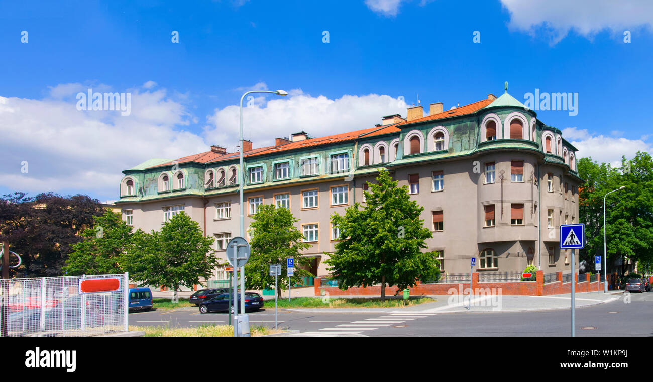 Residential building with round windows on the top floor, wide view ...