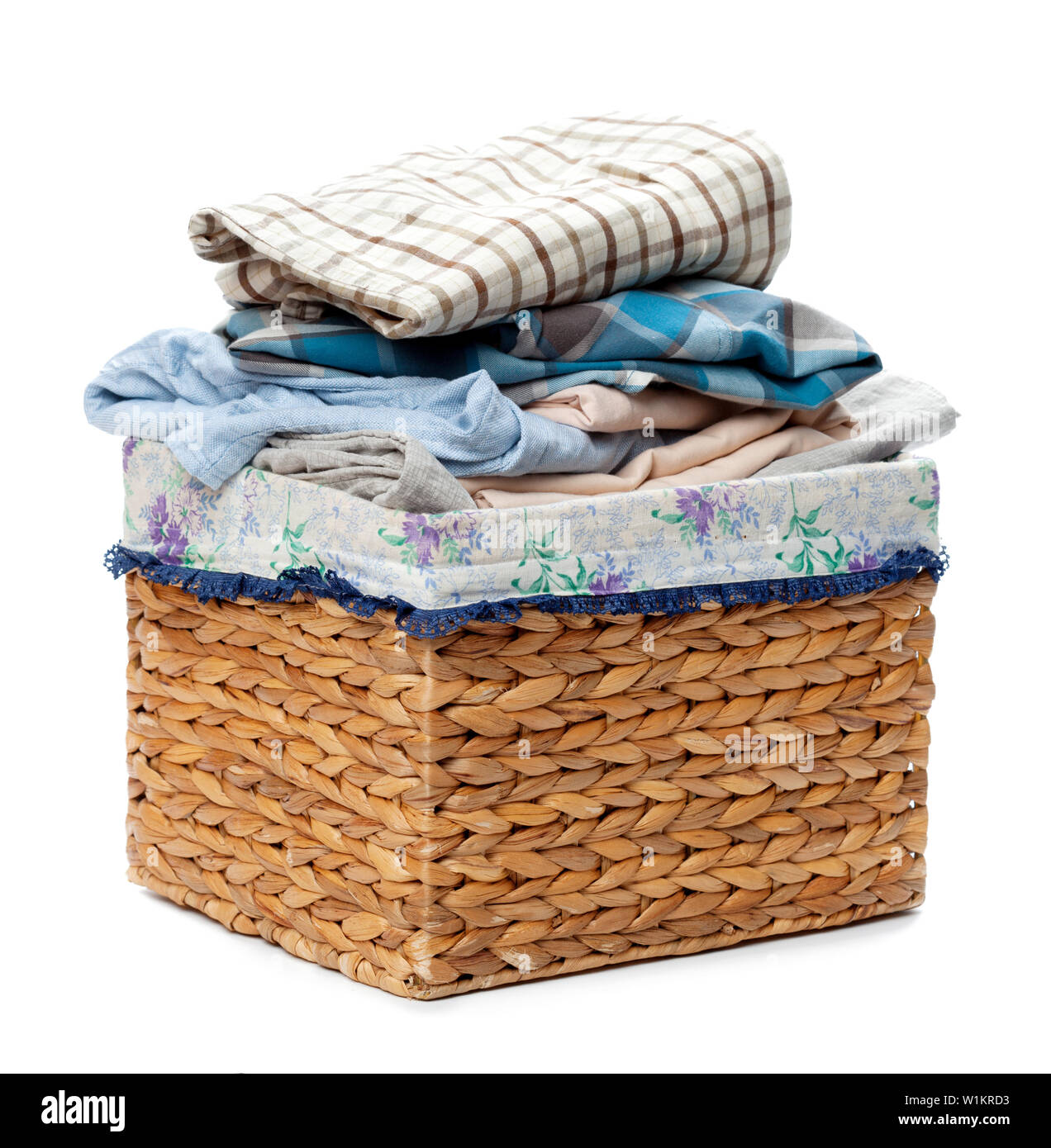 Clothes in a laundry wooden basket isolated on white background Stock ...