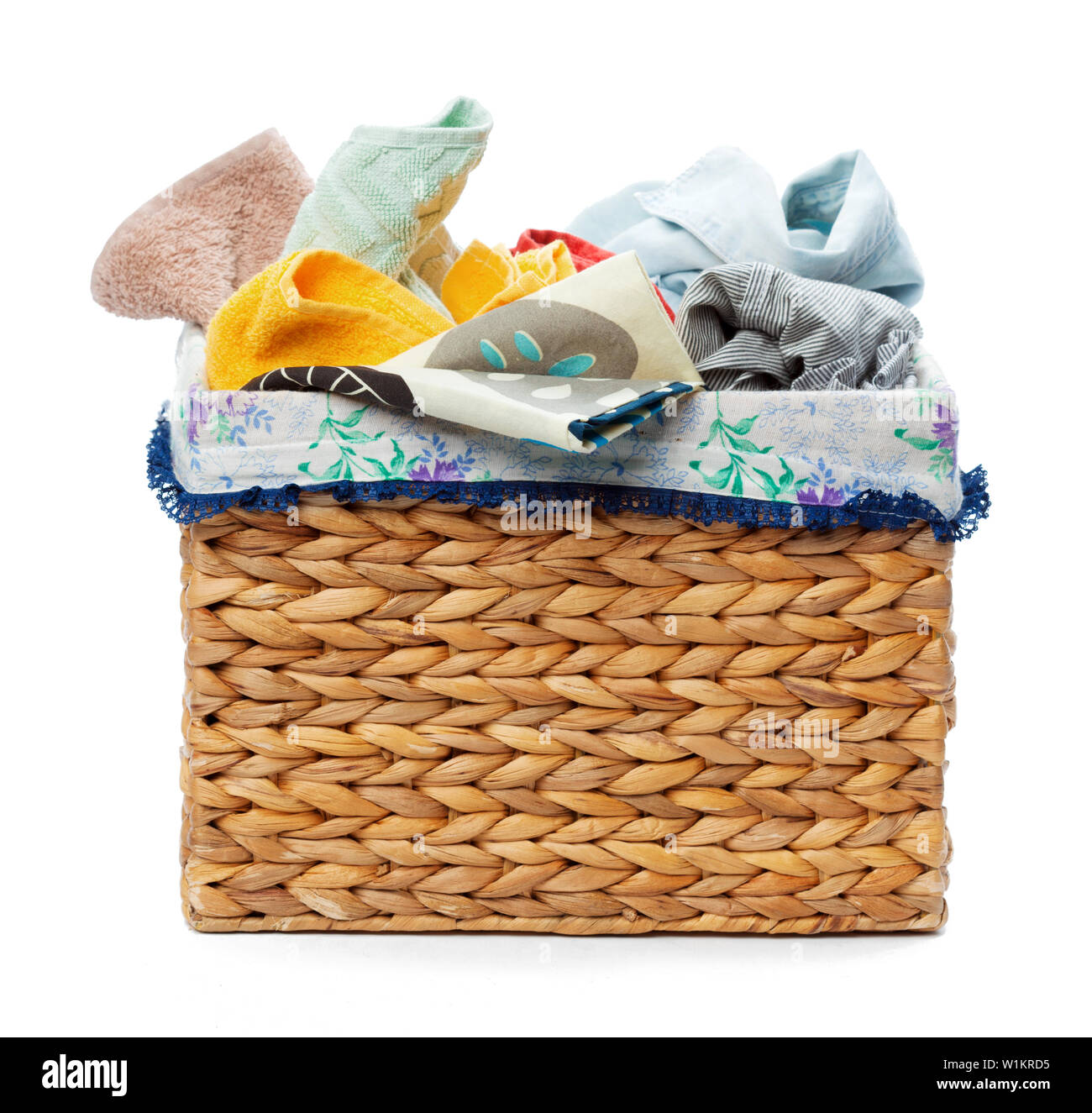 Clothes in a laundry wooden basket isolated on white background Stock ...