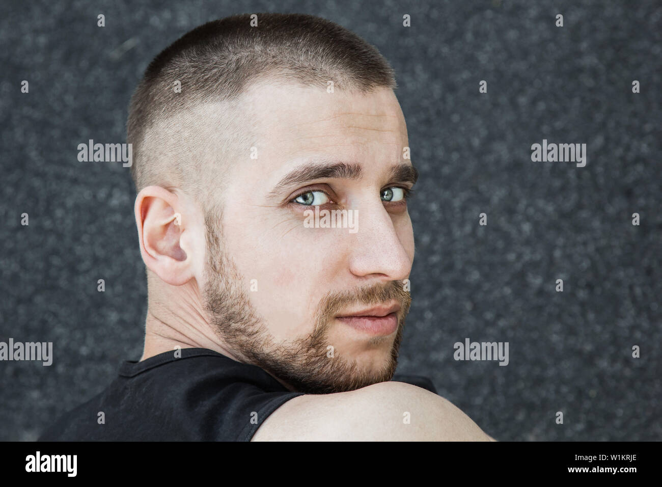 Caucasian man preparing for the start of the sprint. stadium, rubber ...