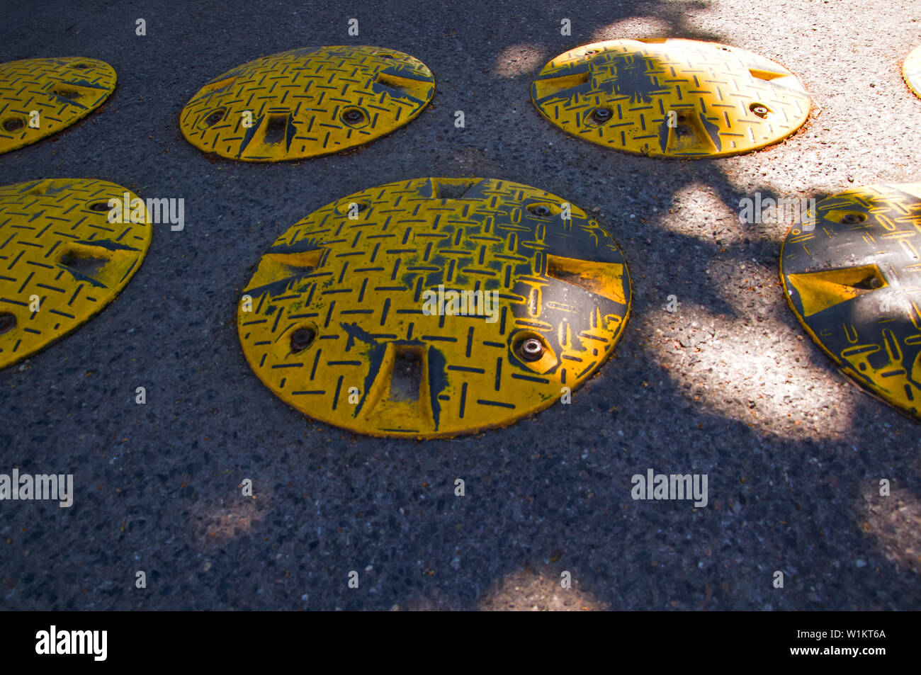 Yellow speed bumps on the road, summer time, Czech Rebuplic Stock Photo ...