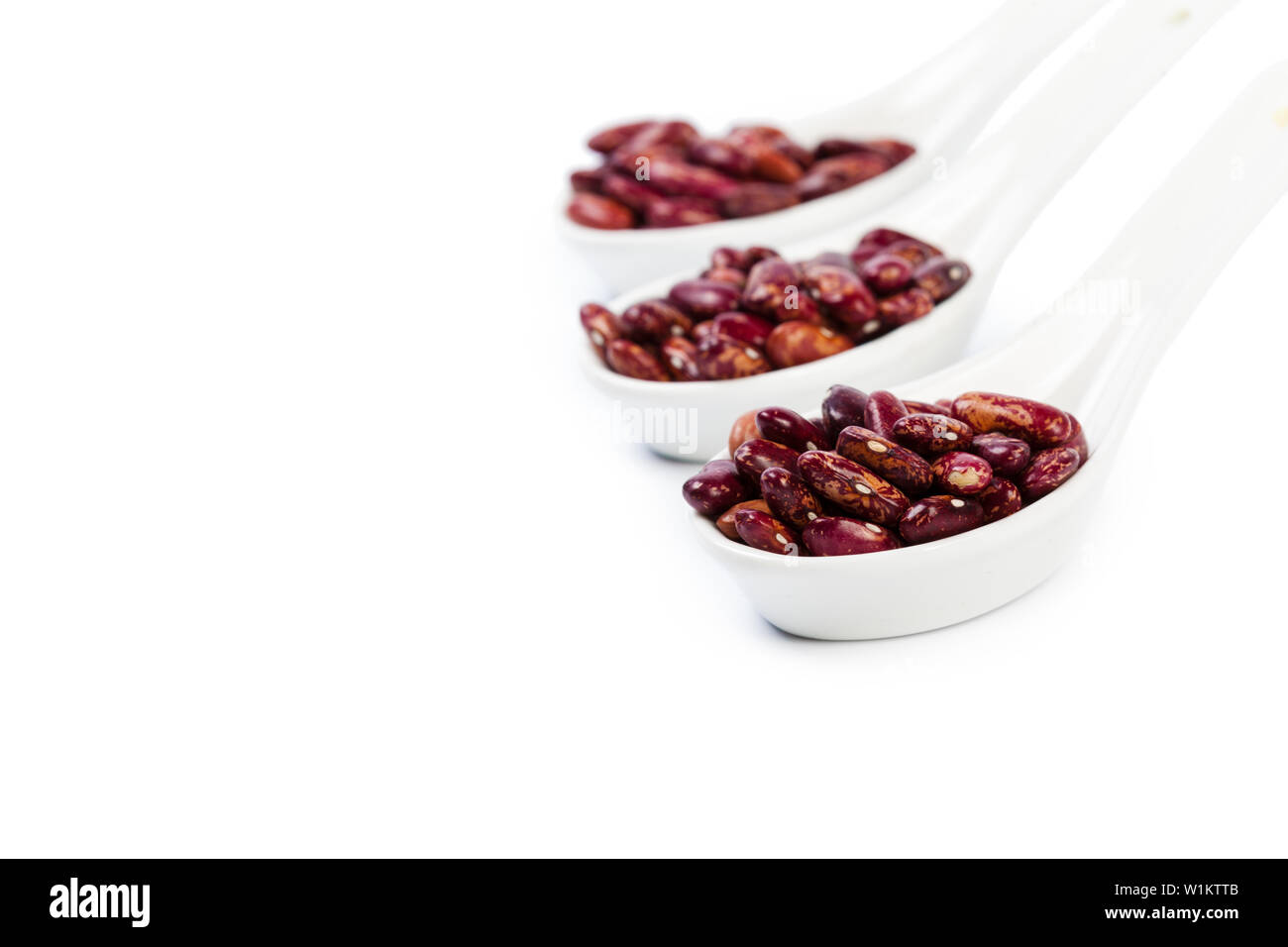 Red beans isolated on white background Stock Photo - Alamy