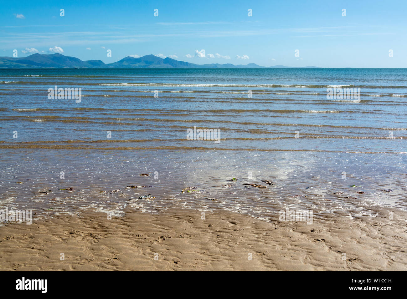Gentle waves on sandy beach of Anglesey and mountains of Snowdonia - 4 ...