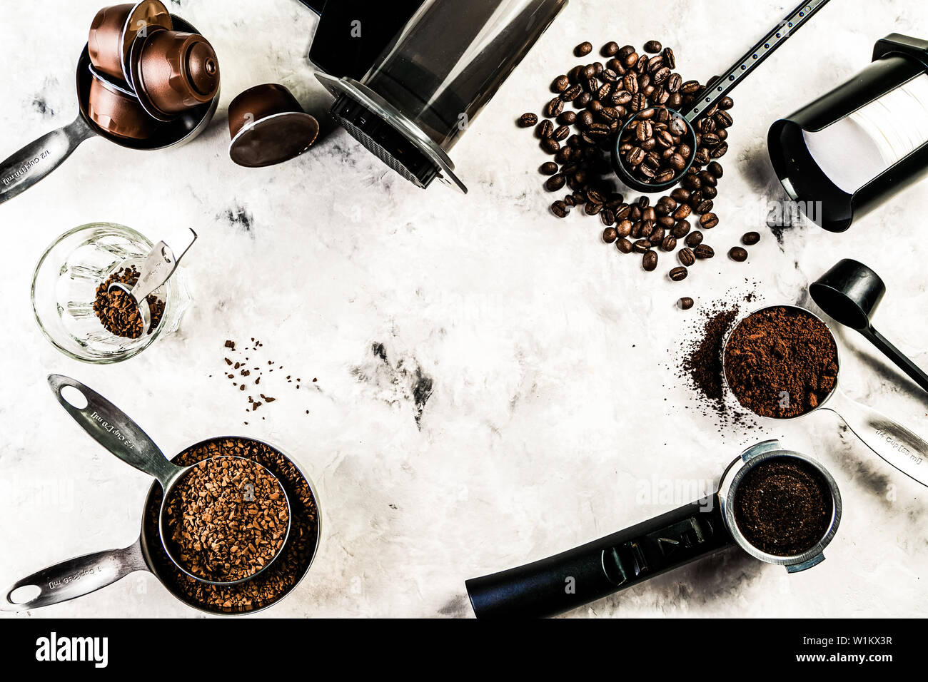 Coffee concept - beans, ground, instant, capsules, marble background ...
