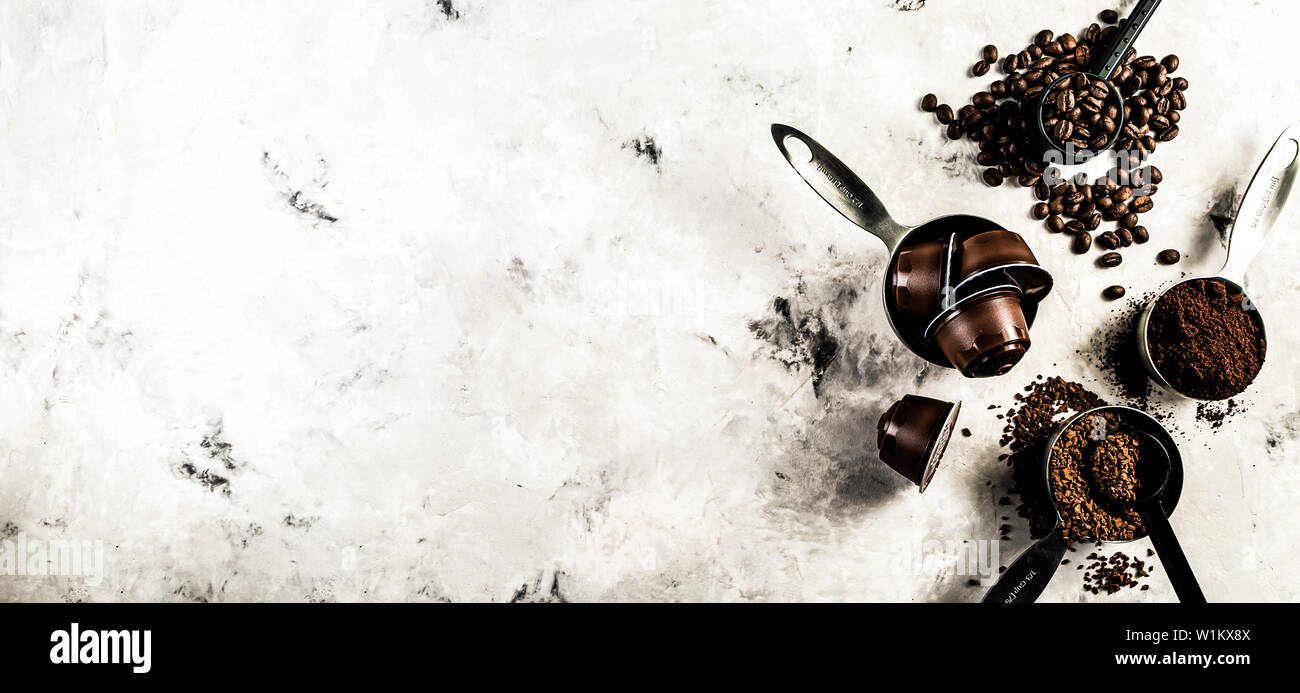 Coffee concept - beans, ground, instant, capsules, marble background ...